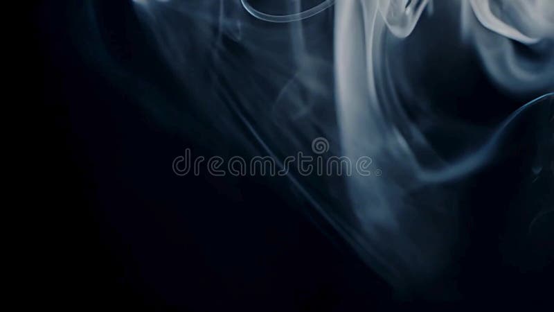 Smoke Flowing Over a Black Surface in Slow, Hypnotic Patterns Stock ...