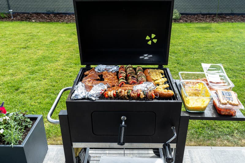 Thick Smoke Rising from a Modern Grill Standing on a Paving Slab on the ...
