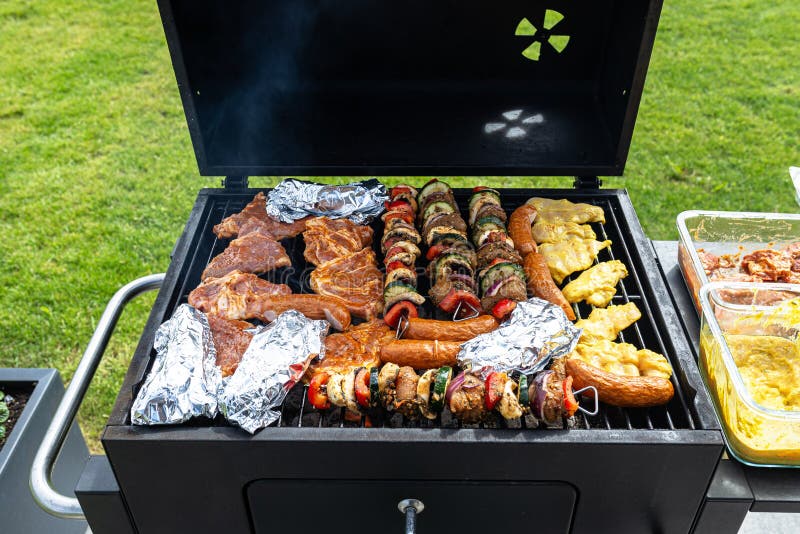 Thick Smoke Rising from a Modern Grill Standing on a Paving Slab on the ...
