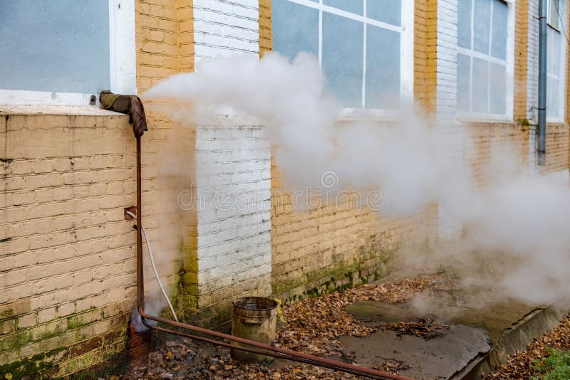 Leakage Of Steam In Heat Pipeline. Steam Outgoing From The Rusty Tube ...