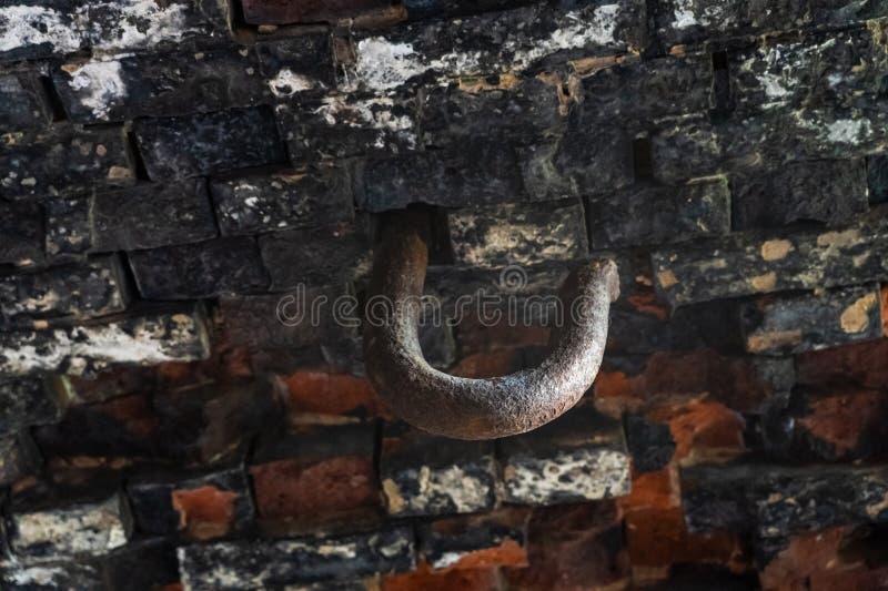 A Thick, Steel Hook in the Ceiling of a Brick Fortress. an Old, Rusty ...