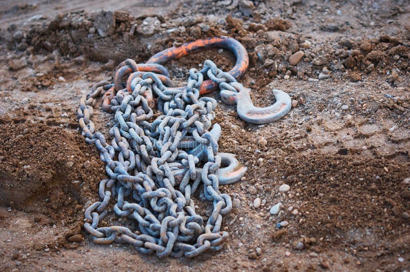 A Thick Transport Chain with a Hook Lies on the Ground at a ...