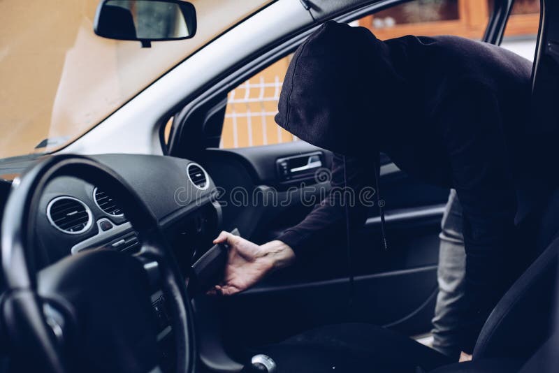 Thief in a Balaclava Stealing Valuables from Car Stock Image - Image of ...