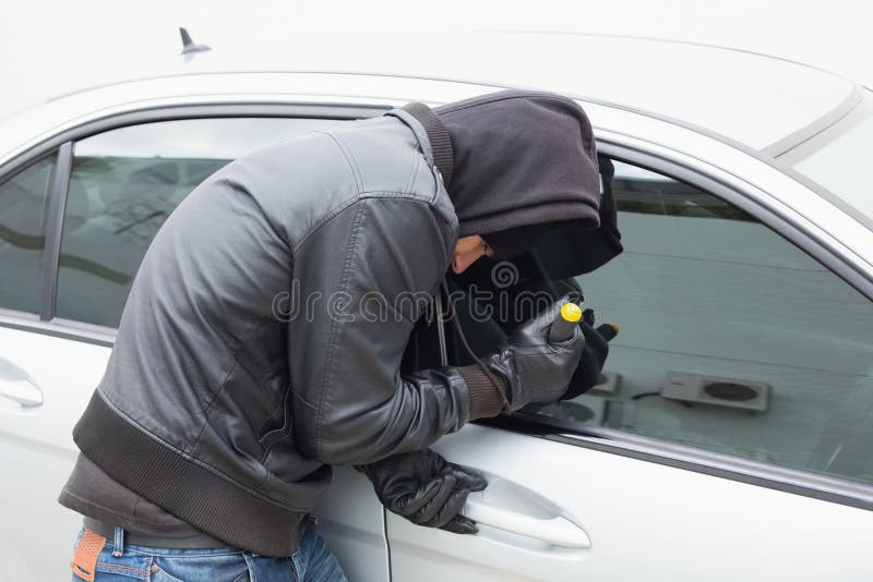 Thief Breaking into Car with Screwdriver Stock Photo - Image of hooded ...