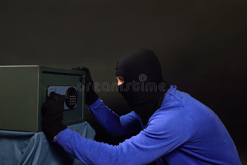 The Thief Breaks the Safe with a Combination Lock Stock Image - Image ...
