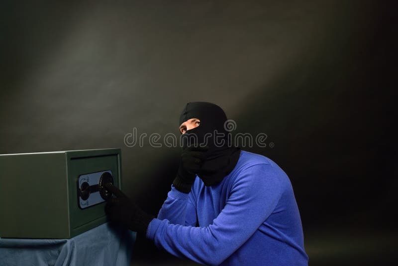 The Thief Breaks the Safe with a Combination Lock Stock Image - Image ...