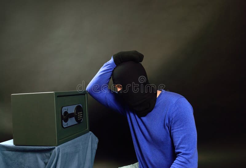 The Thief Breaks the Safe with a Combination Lock Stock Image - Image ...