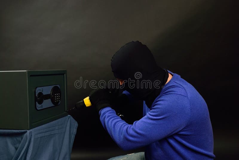 Thief Breaks into the Safe. he Drills Him Stock Image - Image of ...