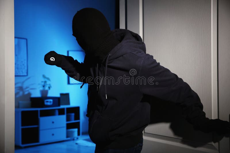 Thief with Flashlight Breaking into House Stock Photo - Image of person ...