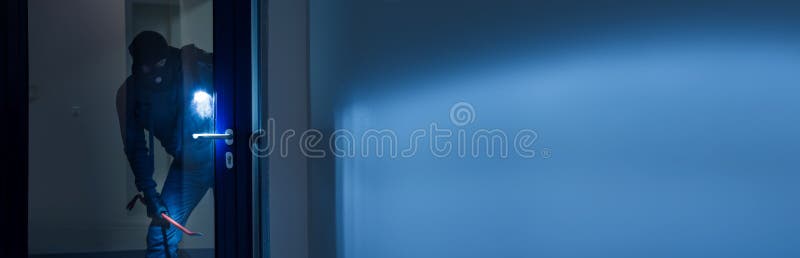 Thief with Flashlight Trying To Break Door Stock Photo - Image of glass ...
