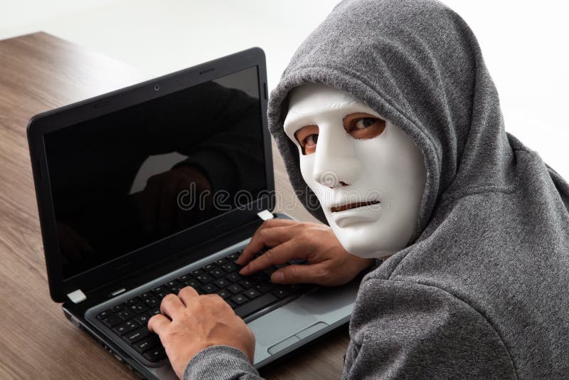 Thief Hacker in Mask Stealing Personal Information from Laptop Stock ...