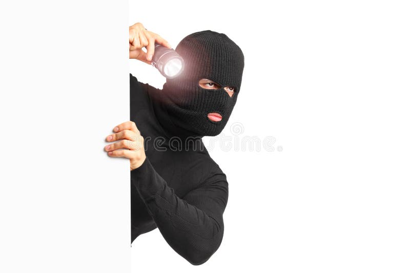 Thief with Holding a Flashlight Behind a White Pa Stock Image - Image ...