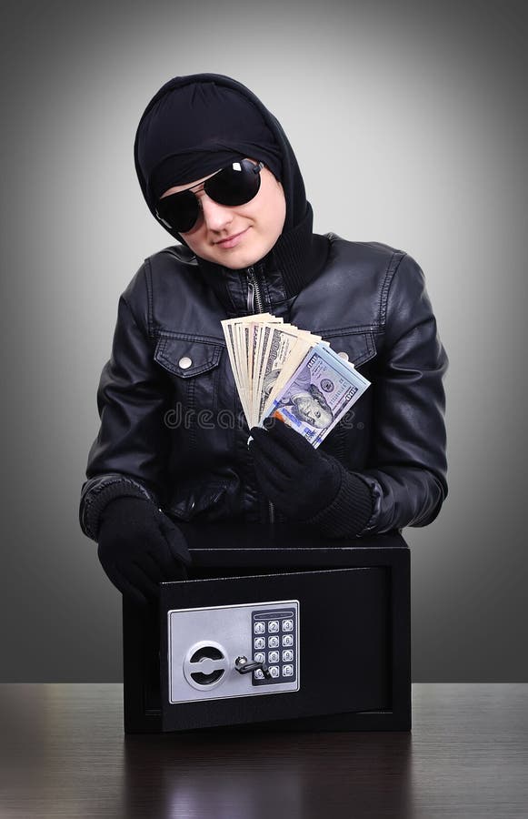Thief Holding a Stolen Dollars Stock Photo - Image of crime, intruder ...