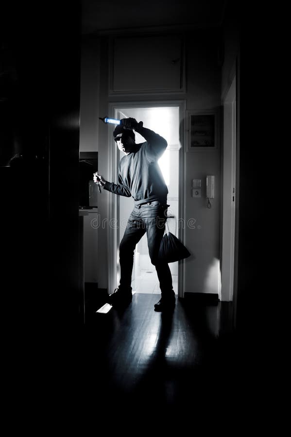 Thief in a house stock photo. Image of inside, lamp, dark - 35674234
