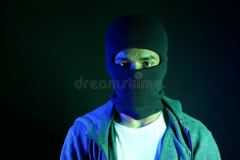 Thief in a Mask on Black Background Close Up, Stock Image - Image of ...