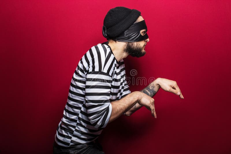A Thief with Mask Quietly Slinking Stock Photo - Image of caucasian ...