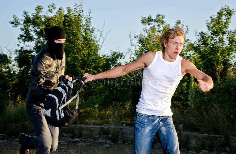Thief stealing a backpack stock image. Image of away - 26186695