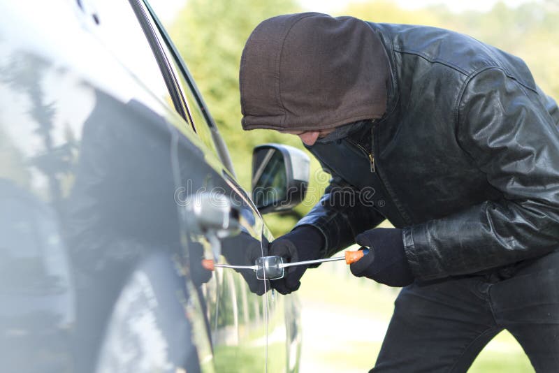 Thief stealing a car stock illustration. Illustration of theft - 52428356
