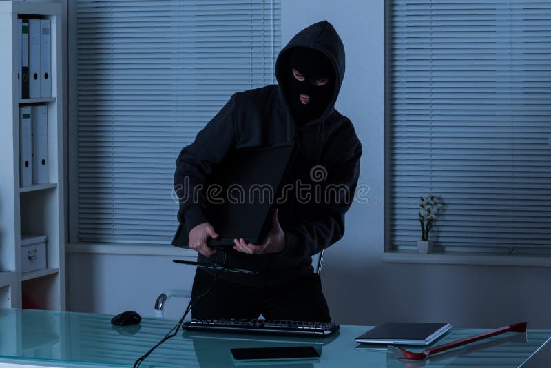 Thief Stealing a Laptop Computer Stock Photo - Image of computer, loot ...