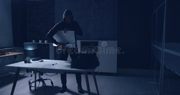 Thief Stealing Computer from Office Stock Photo - Image of office ...