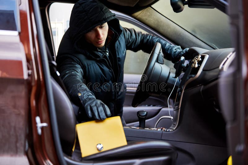 Car Thief in Car Theft on Car Door Stock Photo - Image of crime ...