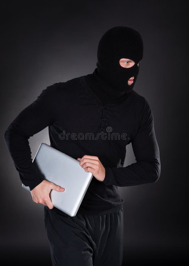 Thief Stealing a Laptop Computer Stock Photo - Image of computer, loot ...