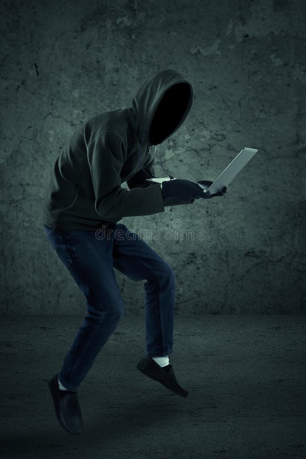 Thief Stealing a Laptop Computer Stock Photo - Image of criminal ...
