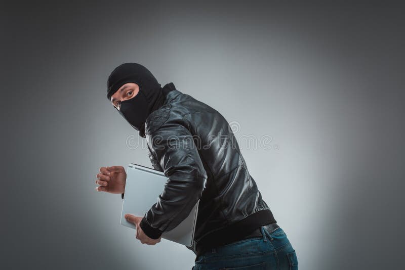 Stealing a laptop stock photo. Image of mobile, isolated - 20359390