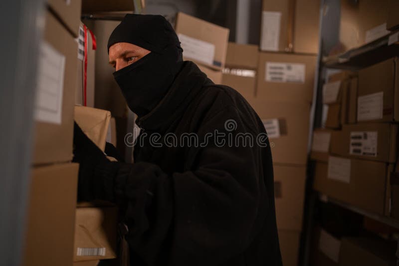 Thief Caught Red-handed in a Warehouse with Cardboard Boxes, Warehouse ...
