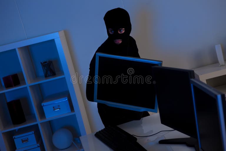 Thief steeling a computer stock image. Image of robber - 28845877