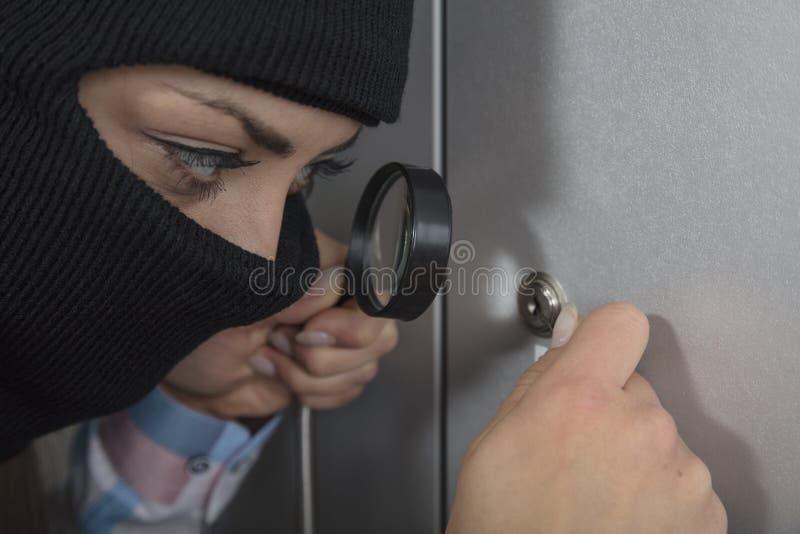 The Thief Tries To Open the Lock Using the Lock Stock Photo - Image of ...