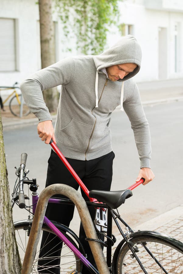 Thief Trying To Break the Bicycle Lock Stock Photo - Image of locked ...