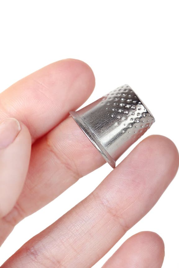 Thimble on middle finger stock photo. Image of thimble - 21173788