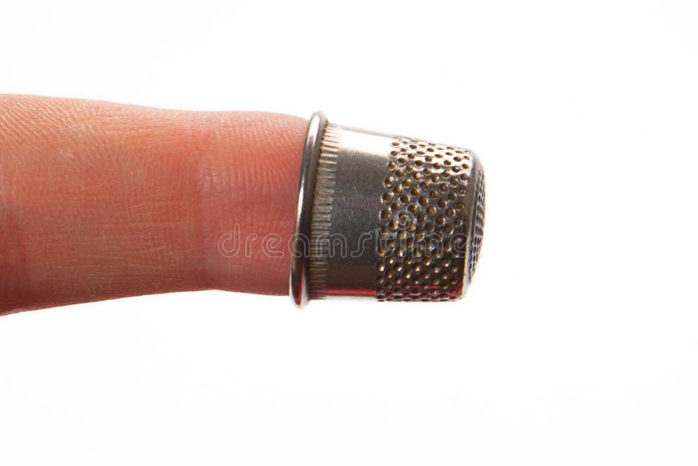 Thimble on Middle Finger, Closeup Stock Photo - Image of middle, eyelet ...