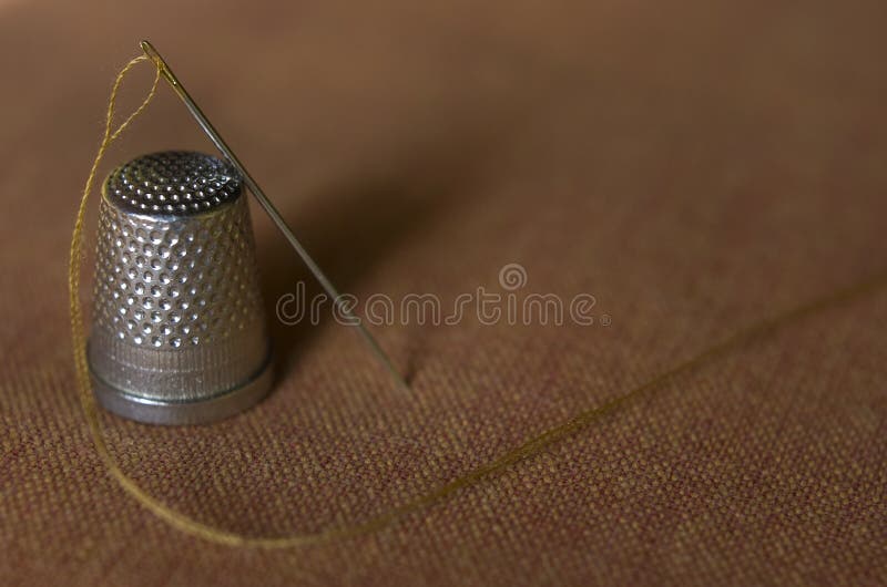 Thimble, Needle and Quilt stock image. Image of closeup - 10219921