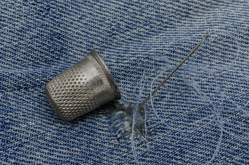 Thimble, Needle, and Thread on Denim Fabric Stock Photo - Image of seam ...