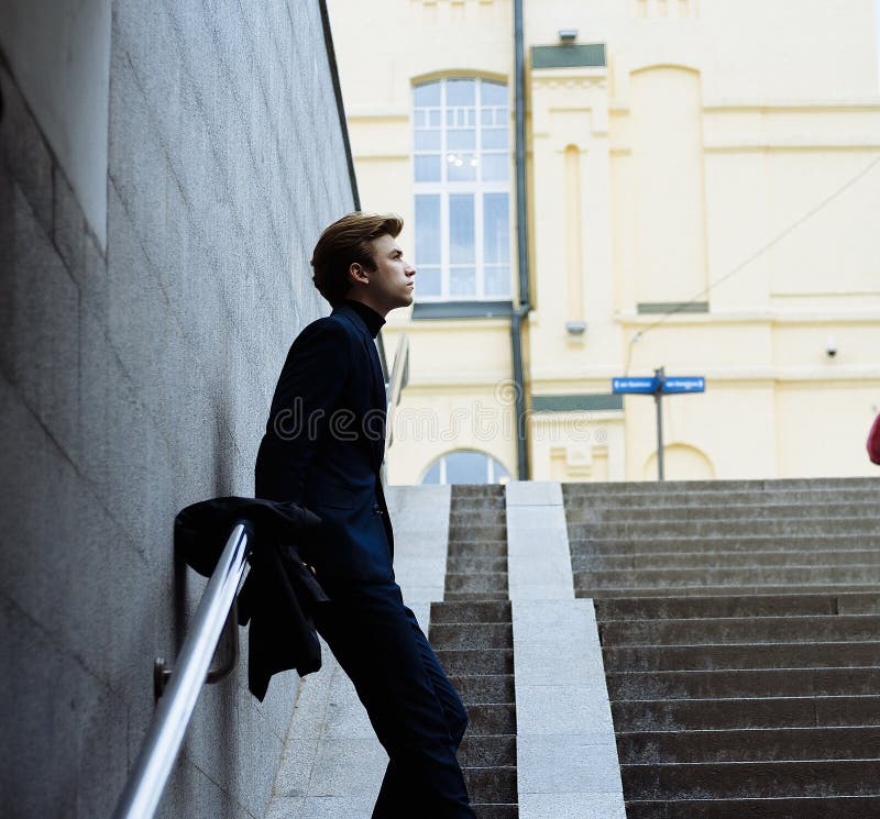 Thin, Attractive Young Man Standing on the Street, Leaning on the Frame ...
