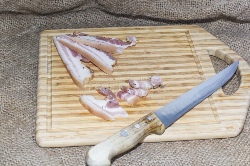 Thin Cut Bacon on a Wooden Board with a Knife Stock Image - Image of ...