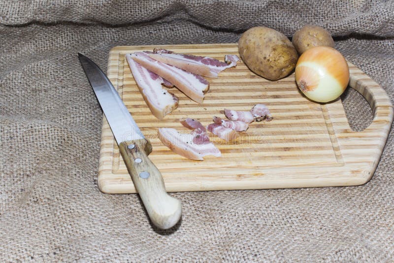 Thin Cut Bacon on a Wooden Board with a Knife Stock Image - Image of ...