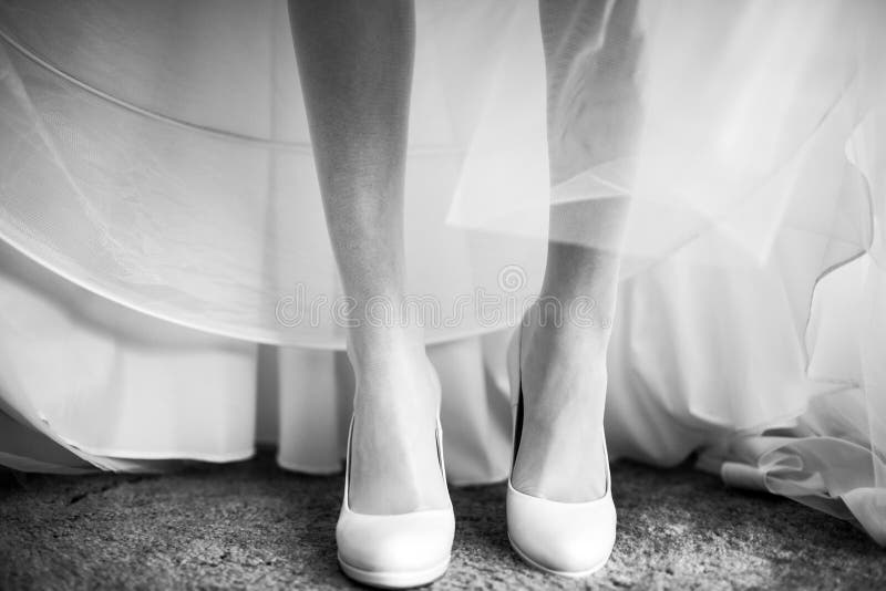 Thin Delicate Bride S Leg in White Shoes Under a Wedding Dress Stock ...