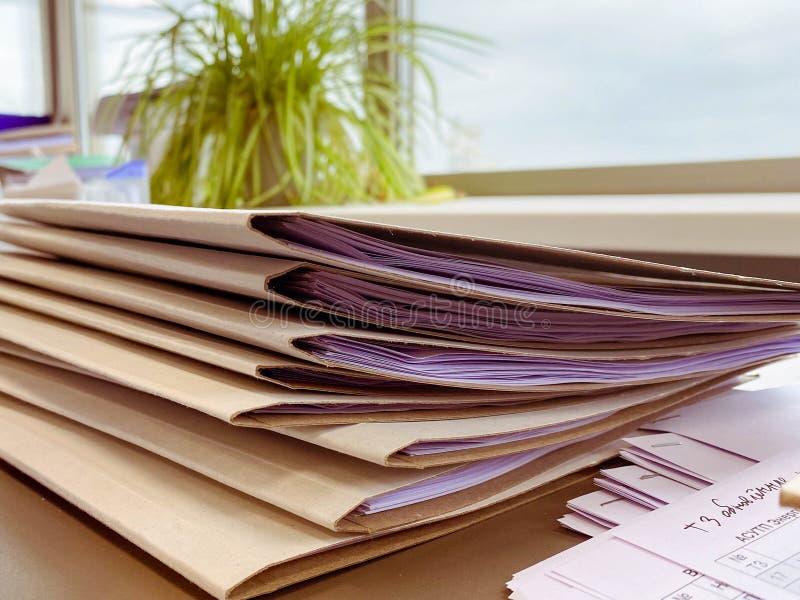 Thin Folders with Sheets of Paper Inside. Brown Corton Folder for ...