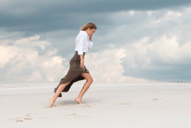 A Thin Girl Walks Heavily Overcoming the Strong Wind Stock Image ...