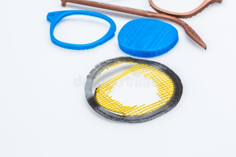 Thin Green 3D Printed Objects with Visible Layers of Plastic that is ...