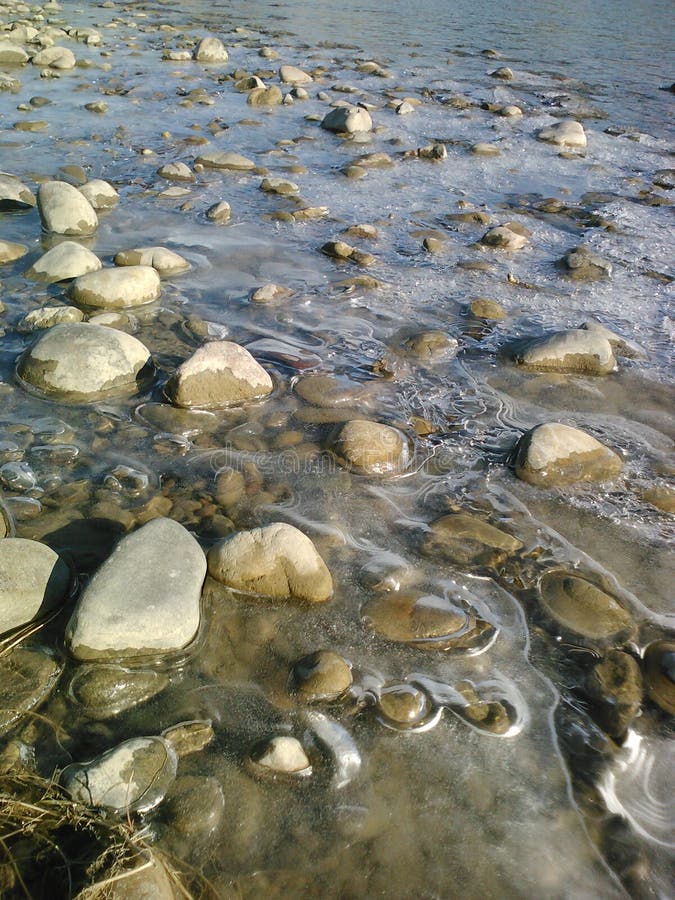 Spring Thaw, Rocks by the River Stock Image - Image of water, melting ...