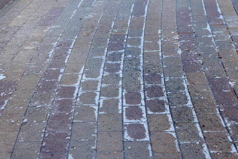 Thin Ice on a Pedestrian Path in a Park, Road Tiles, 2 Stock Image ...