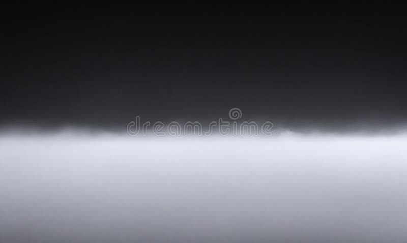 A Thin Layer of Clouds Divides a Dark Sky from a Bright, White Expanse ...