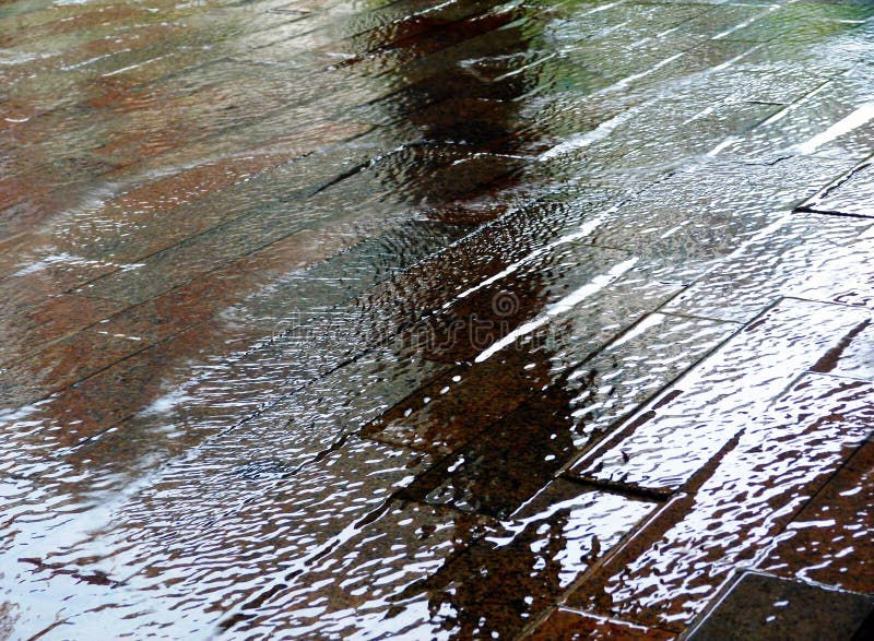 Thin Layer of Rain Water Flowing Over Top of Red Granite Pavement Stock ...
