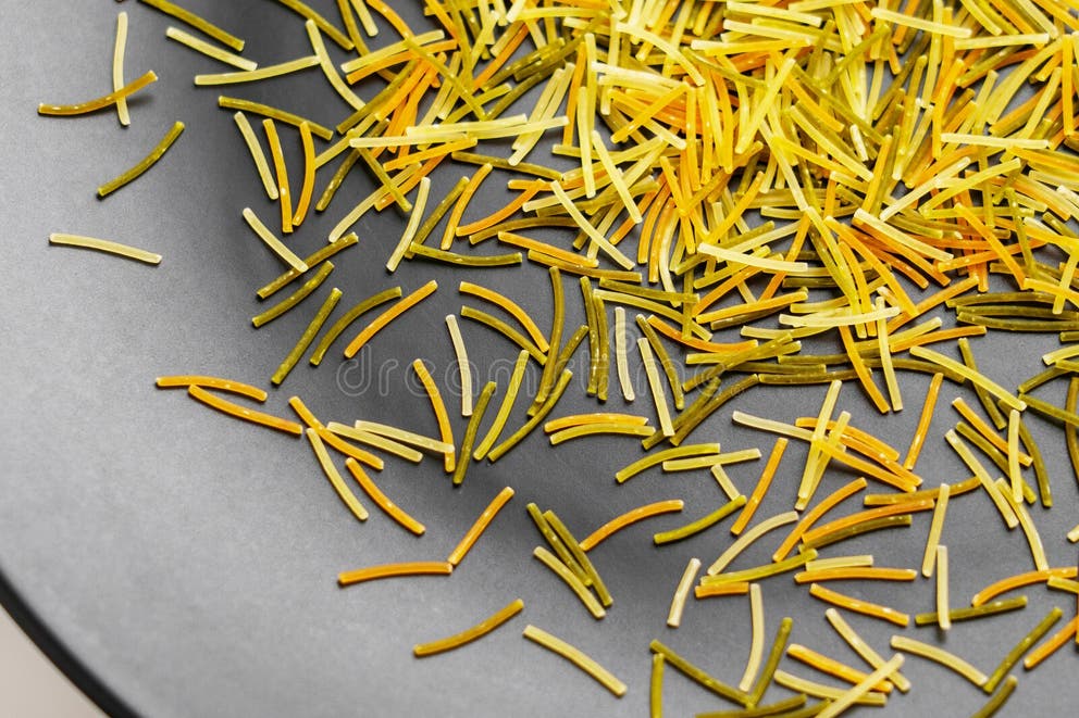 Thin Multi Colored Vermicelli on Black Ceramic Surface Stock Photo ...