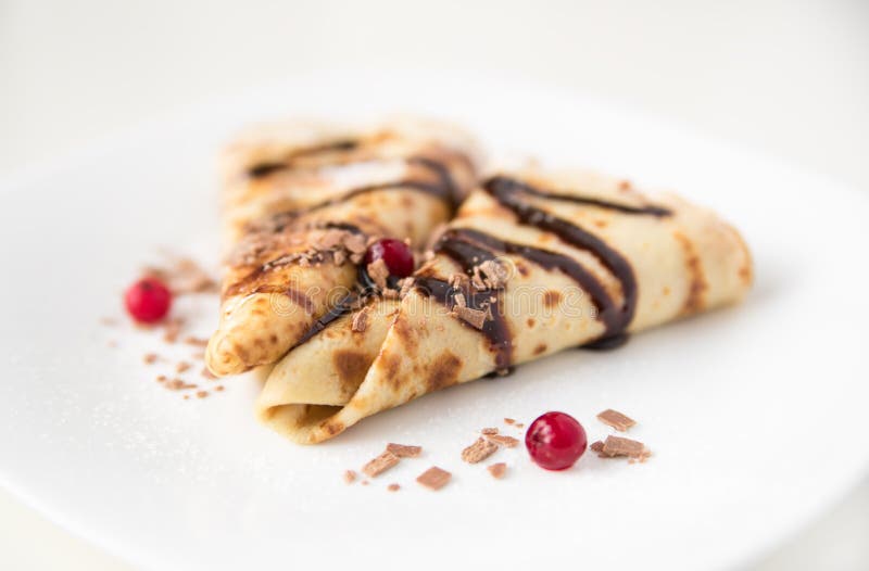 Thin Russian Pancakes Folded Triangle with Strawberry Sauce on a White ...