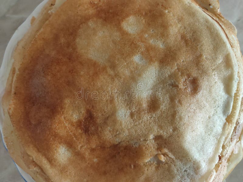 Thin Pancakes on the Plate on the Marble Table. Tasty Homemade Pancakes ...